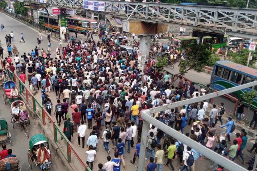 Commuters suffer as seven college students block road again | The ...